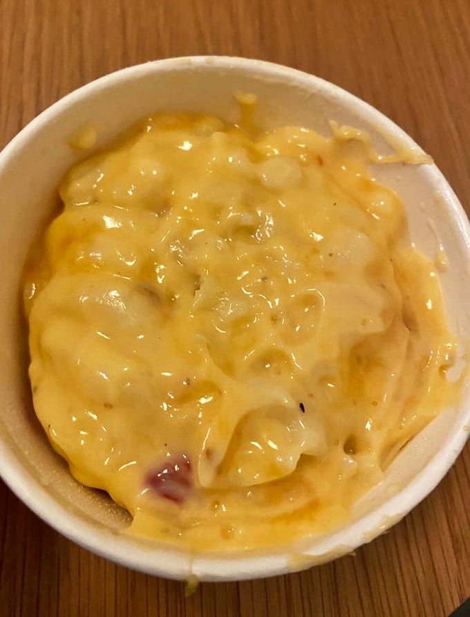 This pimento mac and cheese isn't just a side dish—it's the supporting actor that occasionally steals the show from the headlining hot chicken.