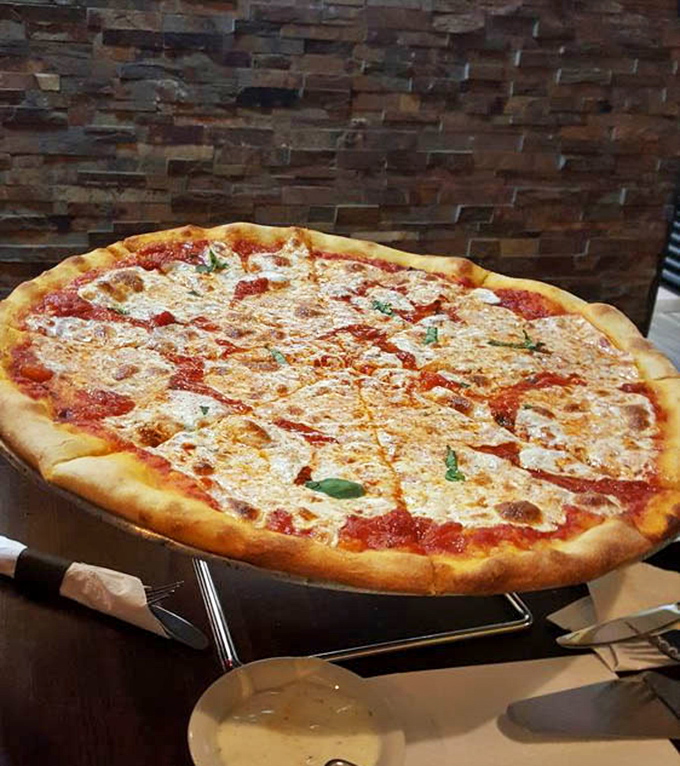 The Margherita pizza in all its glory – the holy trinity of tomato, mozzarella, and basil. Simplicity that sings on your taste buds.