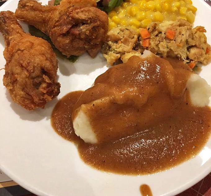 Mashed potato perfection: cloud-like pillows of potato bliss swimming in savory gravy. This isn't a side dish; it's the reason people drive across county lines.