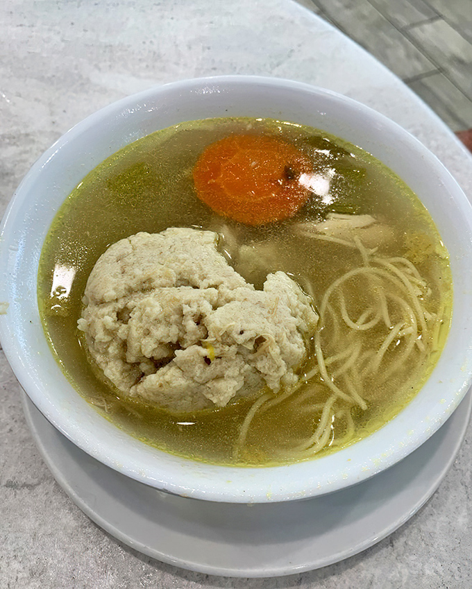 Behold the star attraction&mdash;matzo ball soup that would make your grandmother weep with joy, floating in broth clear enough to read through.