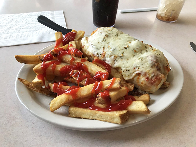 Cheese that stretches to tomorrow! This meatball masterpiece with its golden fries isn't just lunch&mdash;it's a commitment to afternoon happiness.