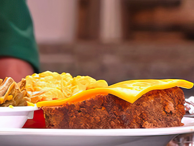 Behold the star of the show&mdash;meatloaf that's been kissed by smoke and crowned with melty cheese. This isn't your cafeteria nightmare; this is meatloaf redemption.