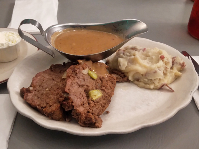 The star of the show: meatloaf that doesn't just sit on the plate—it commands respect, with gravy that deserves its own fan club.