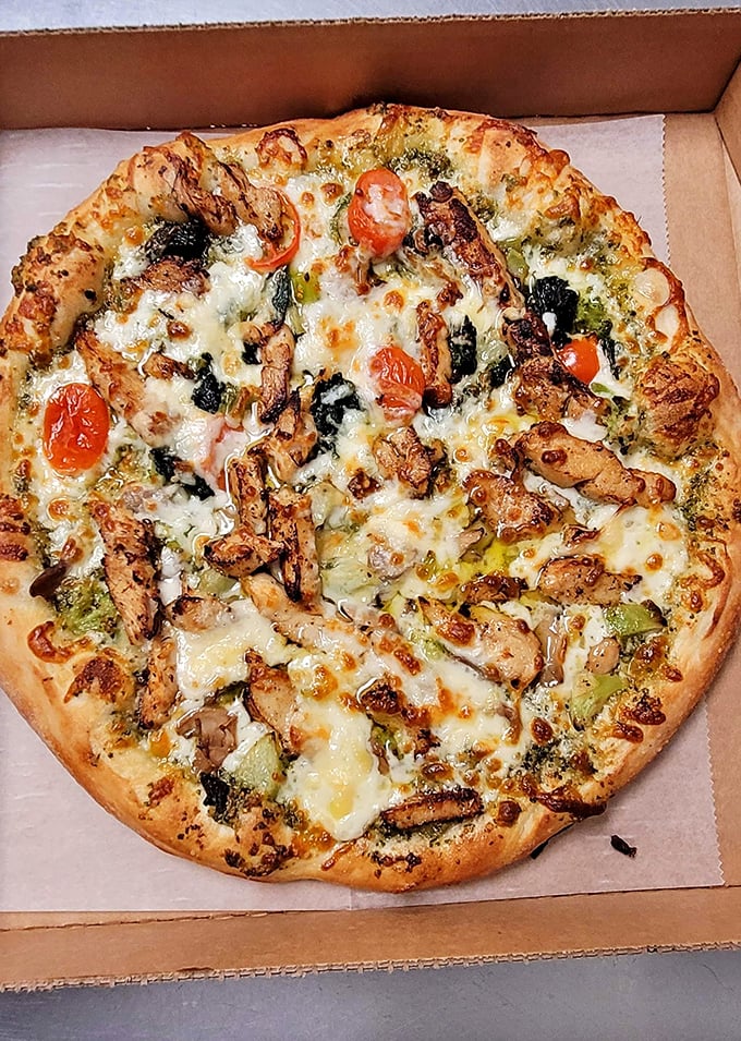 This isn't just pizza &ndash; it's a masterpiece of chicken, pesto, and roasted tomatoes that would make an Italian art restorer weep.