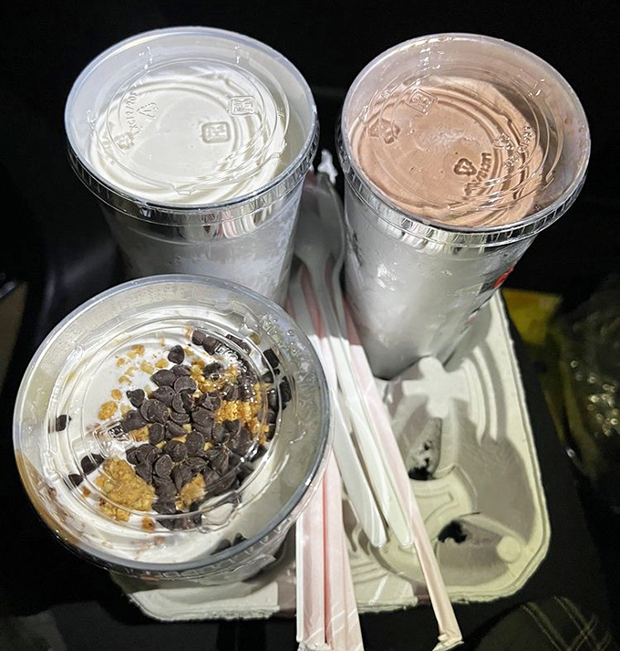 These aren't just milkshakes—they're dairy masterpieces that arrive with their own backup singers in the form of metal mixing cups.