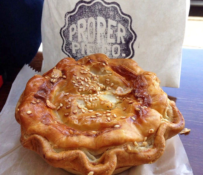 Golden, flaky, and seductively crimped&mdash;this savory pie isn't just food, it's edible architecture with a sesame-studded crown fit for royalty.