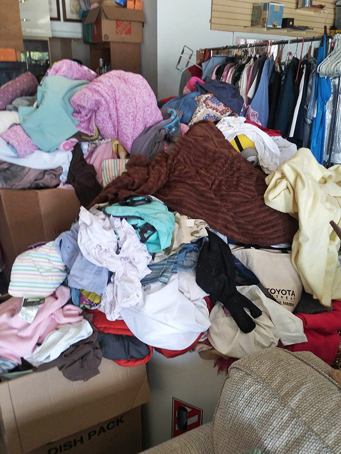 Mountains of fabric tell stories of fashion decades, waiting for their next chapter to begin.