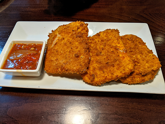 The legendary mozzarella squares in all their golden glory. Crispy armor protecting molten cheese treasure&mdash;worth every mile of Pennsylvania highway you traveled to get here.