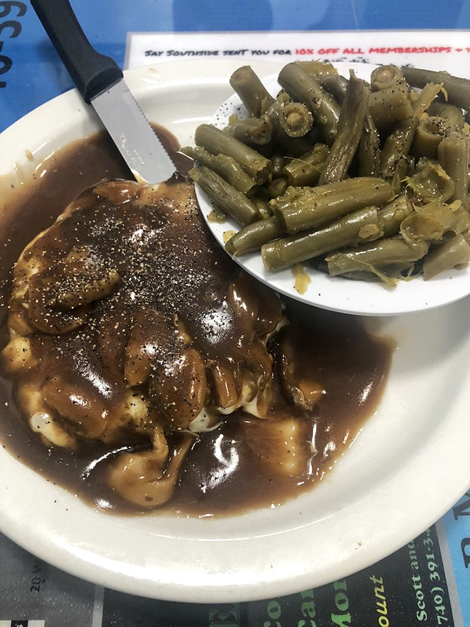 Gravy so rich it should have its own tax bracket, paired with green beans that didn't come from any can. Pure comfort.
