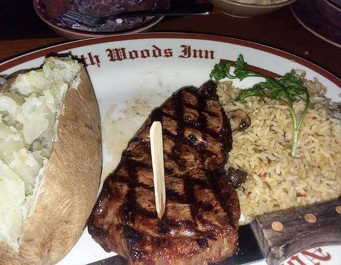 The star of the show: a perfectly seared NY steak with classic sides. This isn't just dinner; it's a carnivore's dream vacation on a plate.