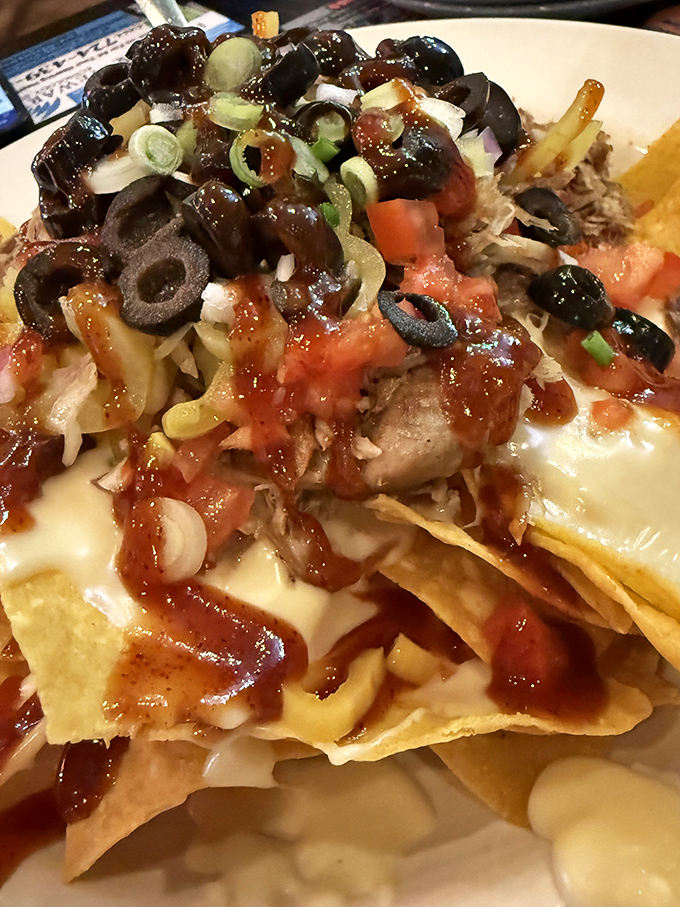 The legendary Nacho Grande &ndash; a mountain of crispy chips, melted cheese, and toppings that makes other nachos look like they're not even trying.