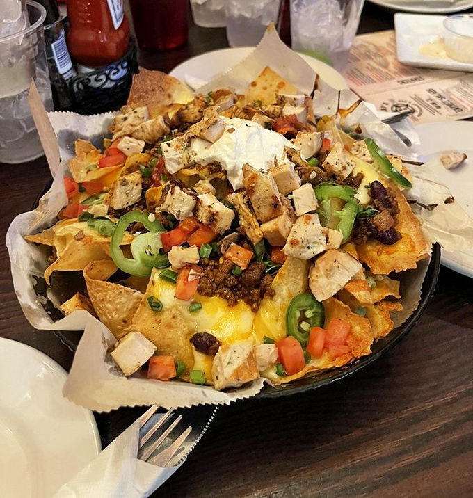 Not just nachos, but a mountain range of crispy chips, melted cheese, and toppings that somehow&mdash;miraculously&mdash;maintain their structural integrity to the very last bite.