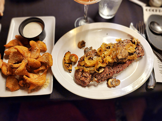 This New York Strip isn't just cooked&mdash;it's been coaxed to perfection, with mushrooms and onions that have clearly been sworn to a delicious oath.