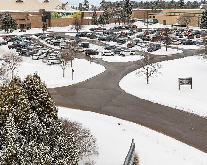 Northern Michigan University's campus sits blanketed in winter white, a hub of learning that brings youthful energy and cultural vibrancy to Marquette year-round.