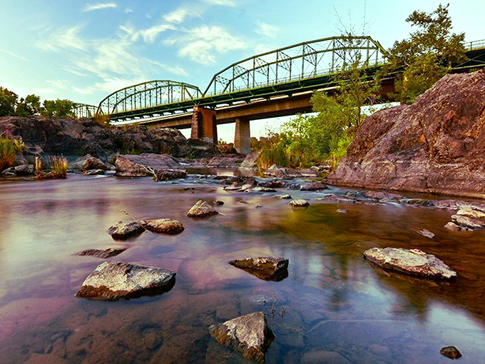 The Feather River flows beneath this historic bridge like nature's own meditation app. Sit here long enough and retirement suddenly makes perfect sense.