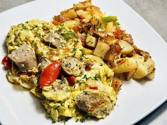 Eggs and sausage performing a perfect tango with herbs and potatoes. This isn't breakfast &ndash; it's edible choreography.
