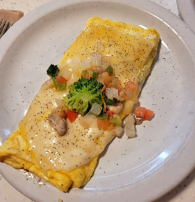 Omelets here aren't just folded eggs&mdash;they're edible envelopes delivering good news to your taste buds with every colorful, cheese-draped bite.