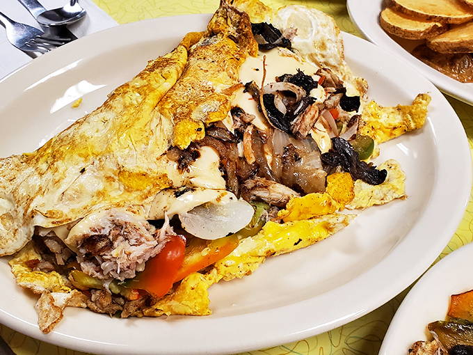 This isn't just an omelet&mdash;it's an architectural marvel of eggs, perfectly folded around a treasure trove of fillings. Breakfast engineering at its finest.