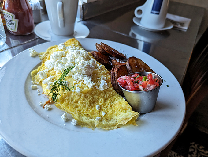 This isn't just an omelet&mdash;it's a fluffy yellow canvas painted with feta, garnished with fresh dill, and served with a side of breakfast bliss.