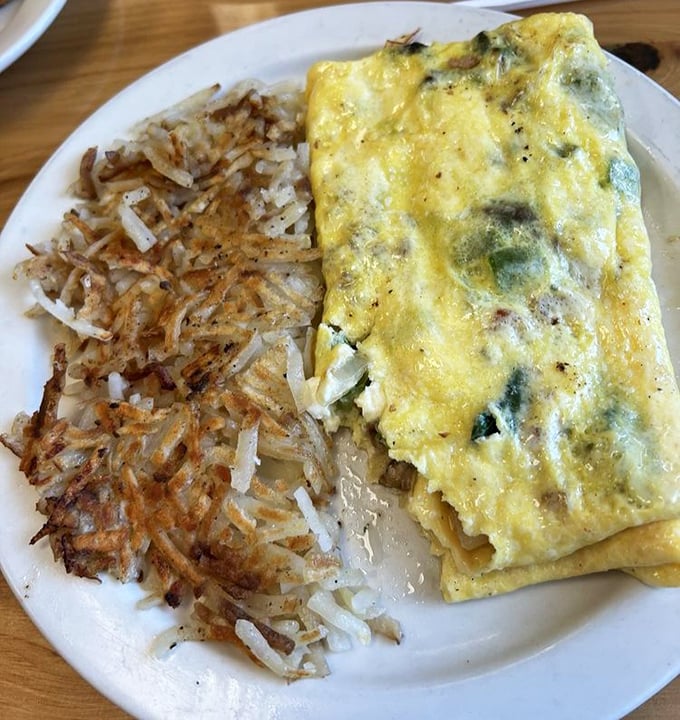 The star of the show: an omelet so perfectly executed it makes you wonder if your grandmother has been secretly moonlighting in this kitchen.