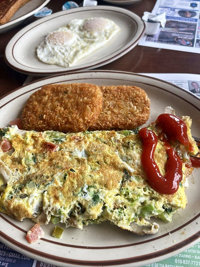 This isn't just an omelet; it's a masterclass in diner perfection. The hash browns deserve their own fan club.