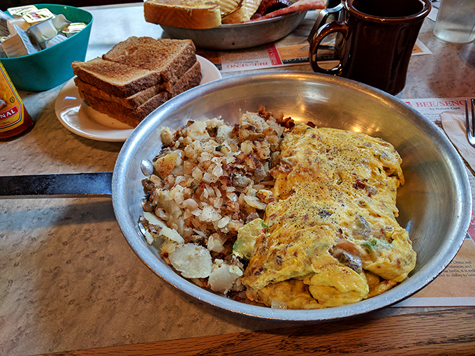 This isn't just an omelet&mdash;it's a golden-hued masterpiece with home fries that could make a potato farmer weep with pride.