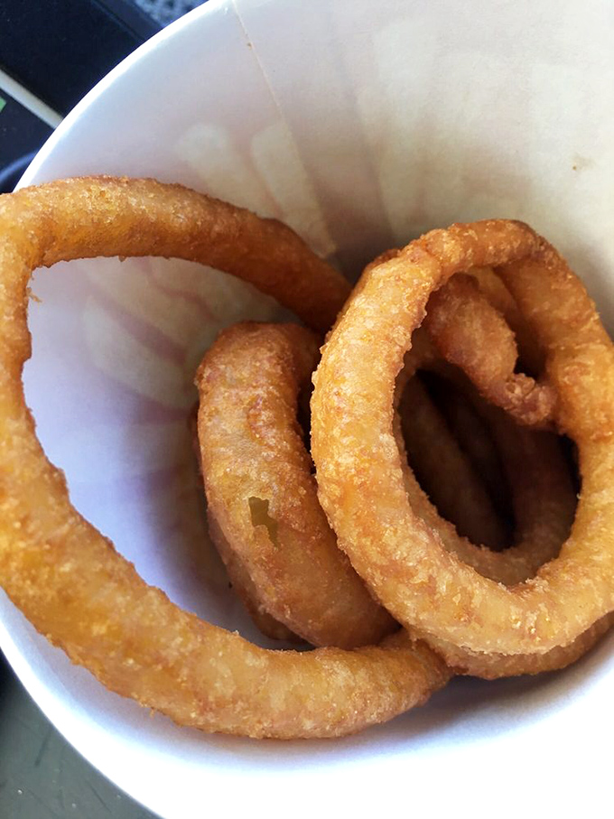 Golden halos of fried perfection&mdash;these onion rings achieve that mythical balance between crispy exterior and sweet, tender interior that makes you forget vegetables are supposed to be healthy.
