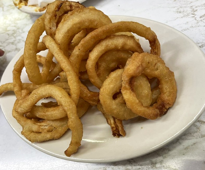 Behold the golden halos of happiness&mdash;Duly's onion rings achieve that perfect balance between crispy exterior and sweet, tender onion that makes you forget vegetables are supposed to be healthy.