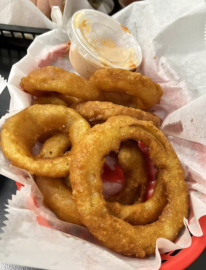 Golden halos of perfection&mdash;these aren't just onion rings, they're crispy, hand-battered masterpieces that could make a food critic weep with joy.