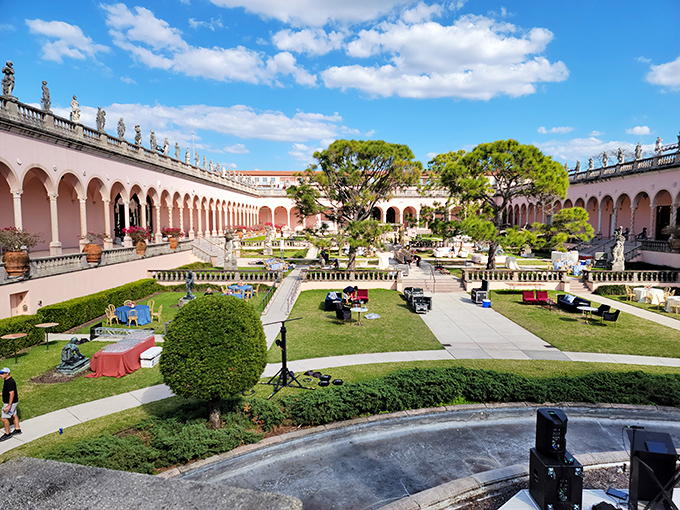 The courtyard garden creates a peaceful oasis where Renaissance-inspired colonnades frame manicured greenery&mdash;nature and architecture in perfect harmony.