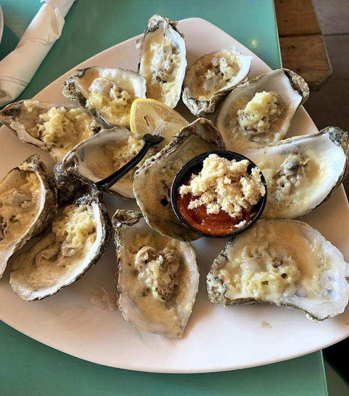These baked oysters aren't just appetizers, they're little porcelain stages where butter, cheese and briny mollusk perform a perfect three-act play.