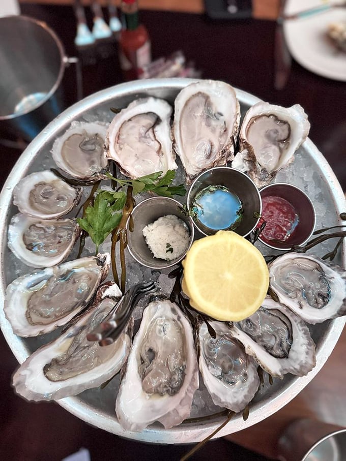 These oysters aren't just served&mdash;they're presented like jewelry on a silver platter, each one a briny little gift from the sea.