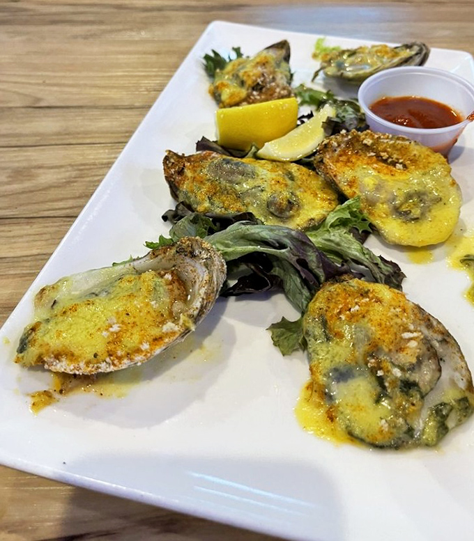 These Oysters Rockefeller are dressed better than most people at formal events, with a cheesy topping that's worth getting fancy for.