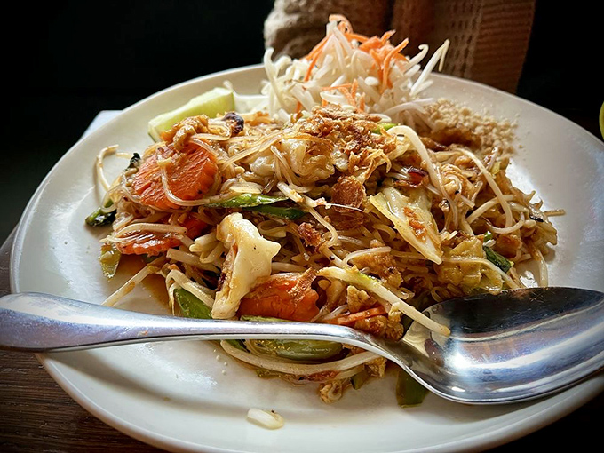 This isn't your college dorm pad thai. Notice the perfect caramelization on those noodles? That's the wok hei flavor that separates the amateurs from the masters.