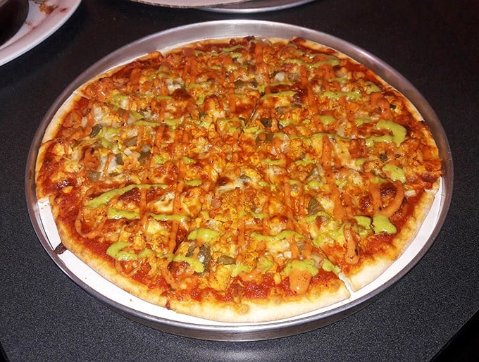 Pizza perfection doesn't need fancy presentation. This veggie-loaded pie speaks the universal language of "get in my belly now."