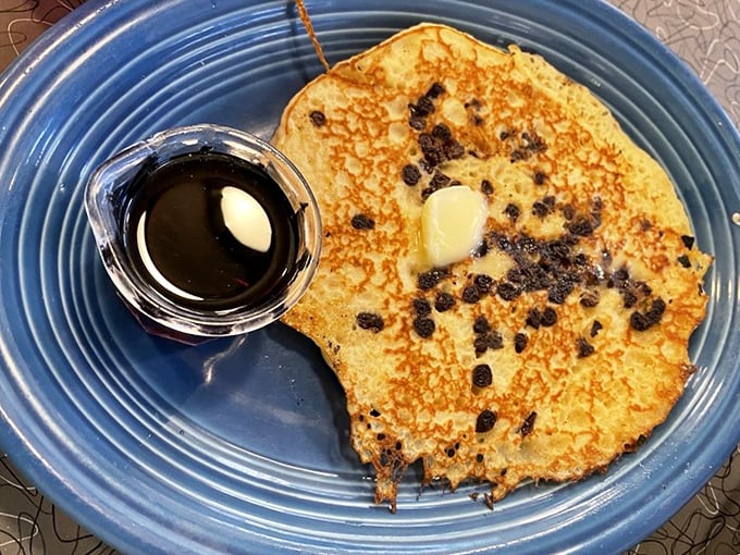 This chocolate chip pancake isn't just breakfast—it's a golden-brown canvas of morning joy with a side of maple possibility.