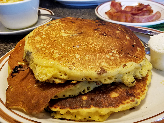 Golden, fluffy pancakes stacked like edible poker chips &ndash; except in this game, everybody wins. The perfect canvas for maple syrup rivers.