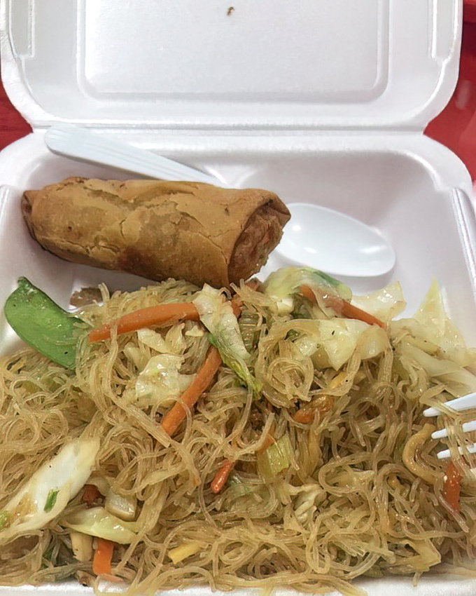 This is pancit in its natural habitat &ndash; delicate rice noodles mingling with fresh vegetables and a lumpia sidekick that's ready for its close-up.