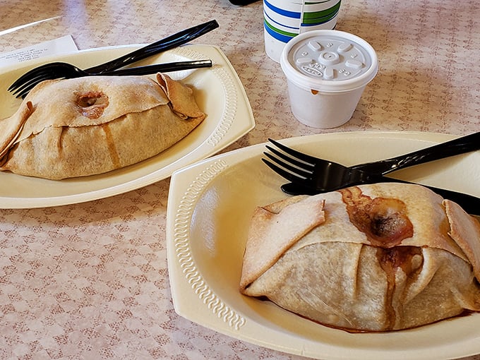 Golden-brown pasty pockets ready for their close-up, looking like edible envelopes stuffed with pure Michigan tradition.
