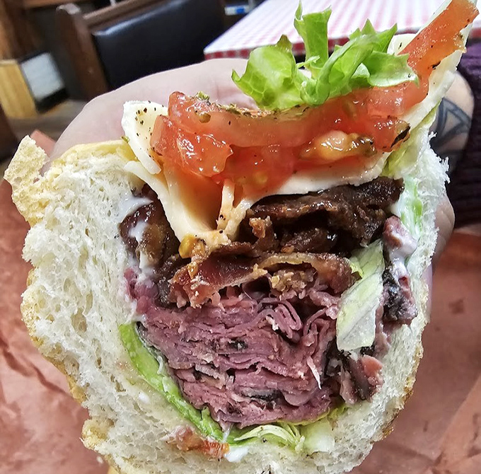 Layer upon glorious layer of pastrami, stacked with the architectural precision of a delicious skyscraper. This isn't just lunch; it's an edible monument.