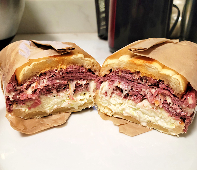 Behold the pastrami masterpiece &ndash; layers upon layers of pink perfection that would make a cardiologist weep with conflicted emotions.