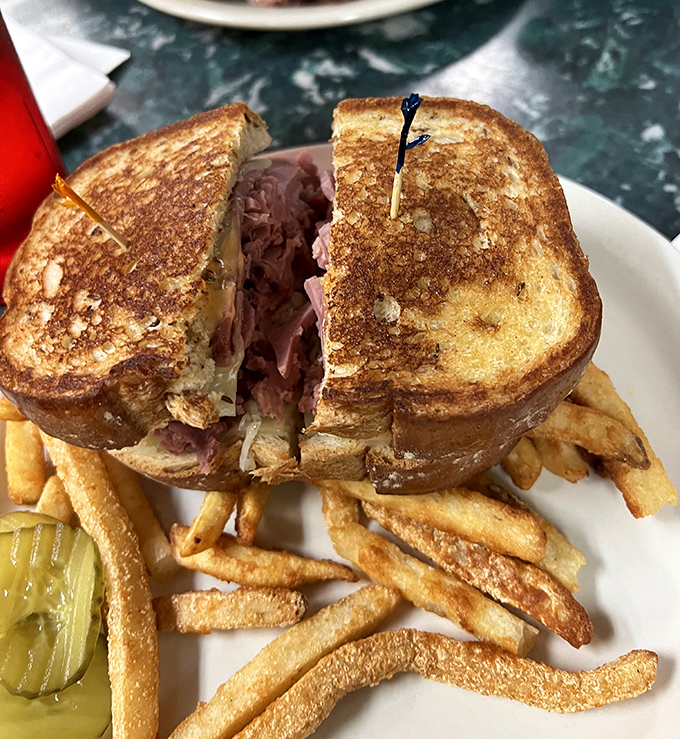 This golden-grilled sandwich isn't just lunch &ndash; it's an architectural marvel of melty cheese and savory meat that demands to be photographed before devoured.