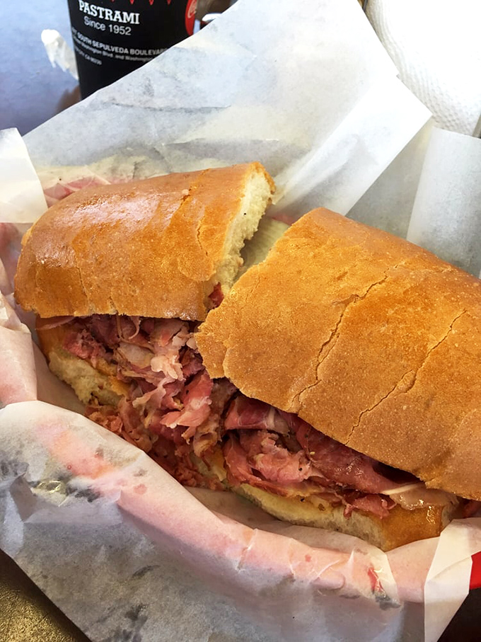 Not so much a sandwich as a monument to meat. This pastrami masterpiece requires both hands, several napkins, and absolutely zero regrets.
