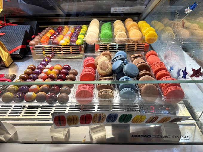 The macaron rainbow isn't just a feast for the eyes&mdash;it's edible architecture, where each perfectly formed shell represents countless hours of French pastry tradition.