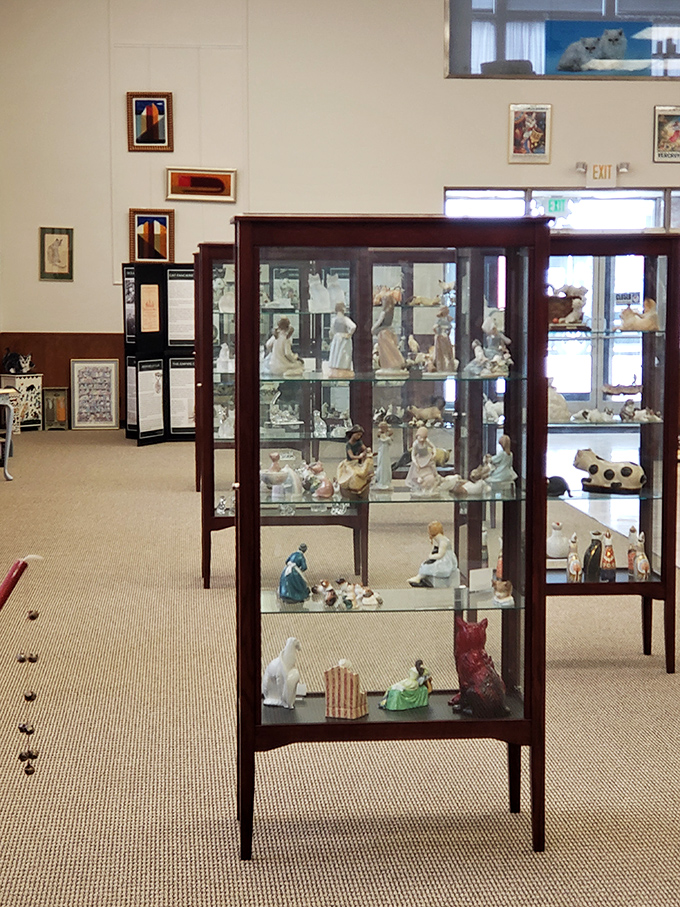 Elegant display cases showcase centuries of cat collectibles, proving our obsession with these furry companions is nothing new.