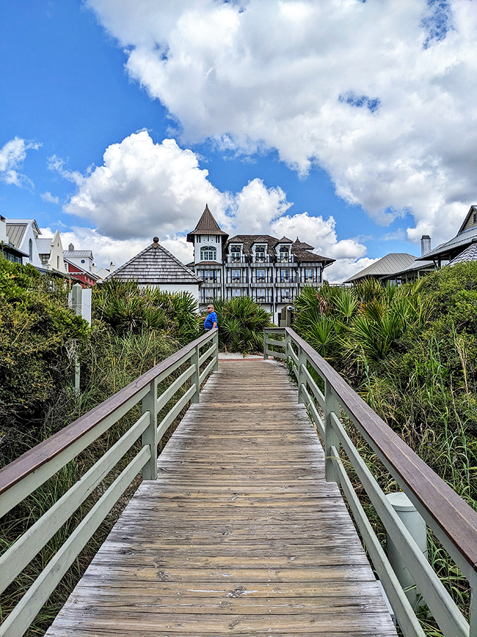 The wooden boardwalk cuts through sea oats and dunes, leading to architectural wonders that somehow make you feel both at home and transported to another world.