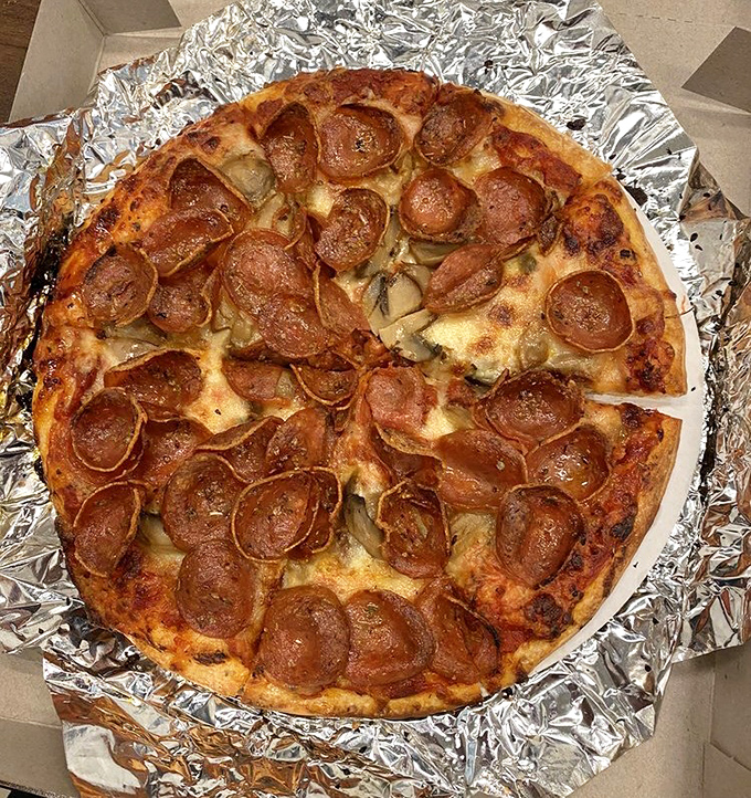 Those curled-up pepperoni cups aren't just toppings&mdash;they're tiny flavor reservoirs collecting all the savory goodness pizza dreams are made of.