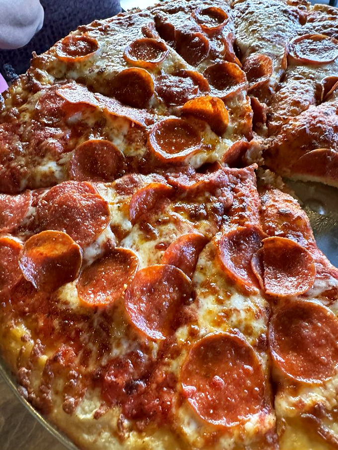 Pepperoni that curls into perfect little flavor cups, creating crispy edges and pools of savory goodness. This is pizza engineering at its finest.
