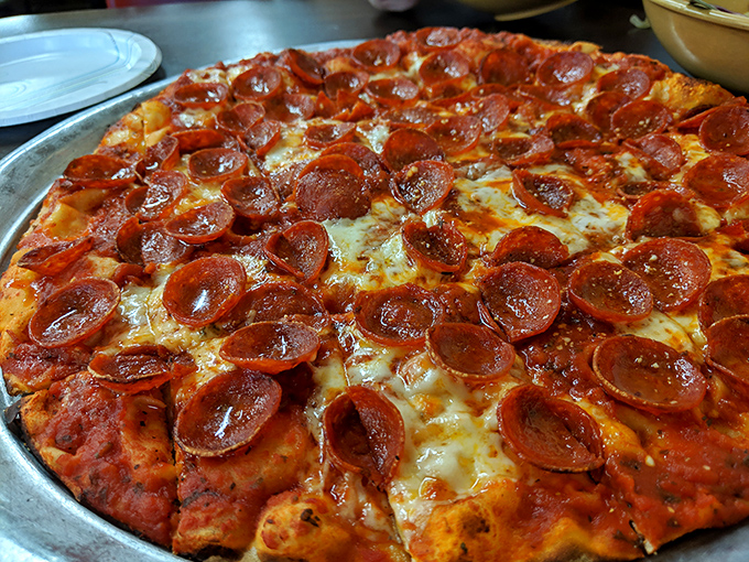 Pizza perfection defined: those curled pepperoni cups create tiny flavor reservoirs of spiced oil. Each crispy edge is like the pizza equivalent of corner brownies.