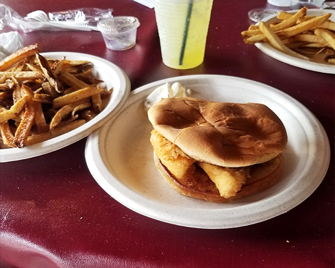 Behold the star of the show: golden-fried perch nestled in a soft bun, accompanied by crispy fries. Simple perfection doesn't need fancy plating.